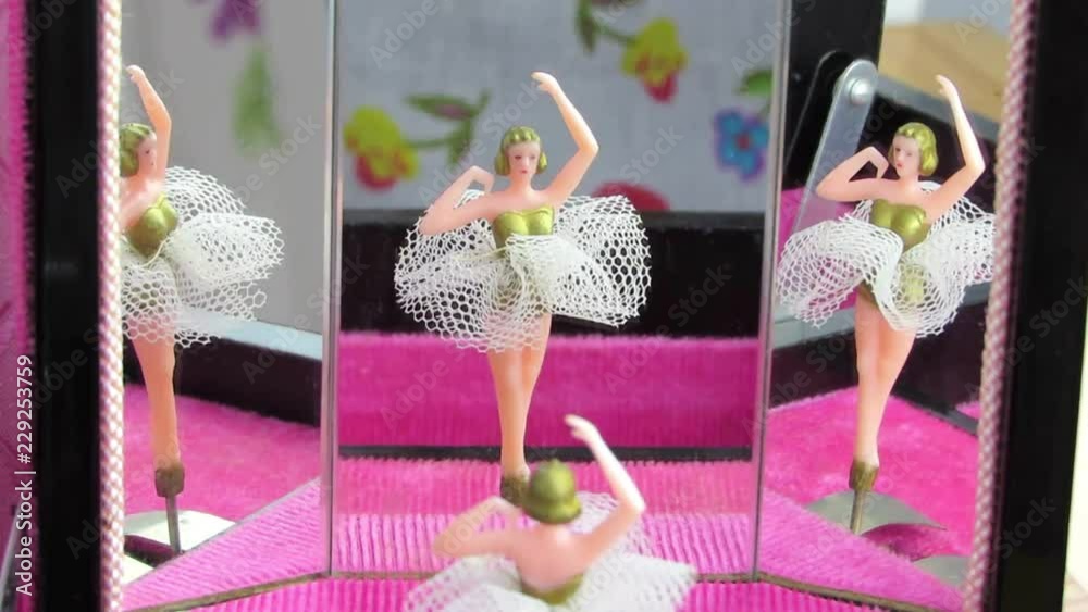 Jewellery box dancing ballerina reflected in three mirrors. The vintage ...