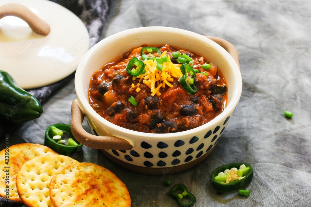 Homemade Beef Chili topped with Cheddar cheese and green onions Stock ...