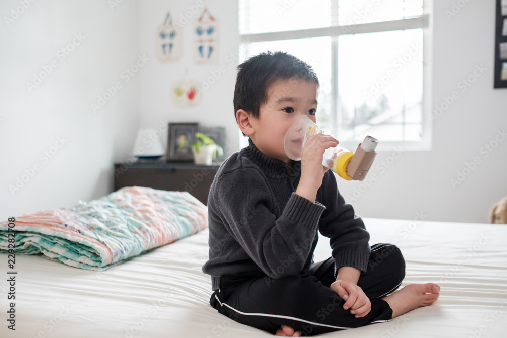 Asian Kid Using Asthma Inhaler Medication Stock Photo | Adobe Stock