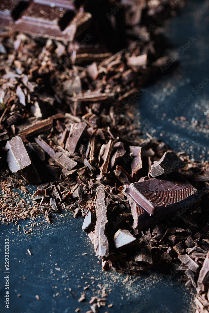 Chocolate. Shards of chopped chocolate on metal background. Stock Photo ...