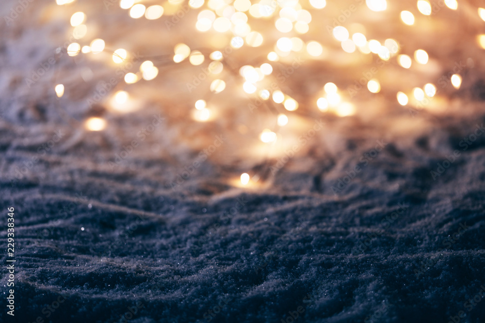 Snowy winter background with fairy lights. Stock Photo | Adobe Stock