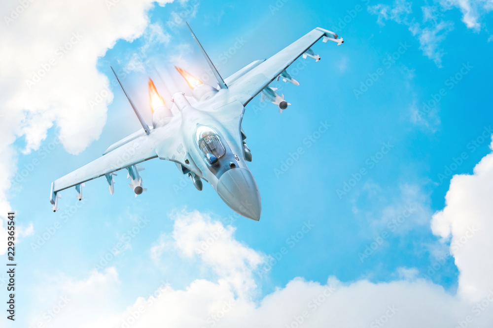 Combat fighter jet on a military mission with weapons - rockets, bombs ...