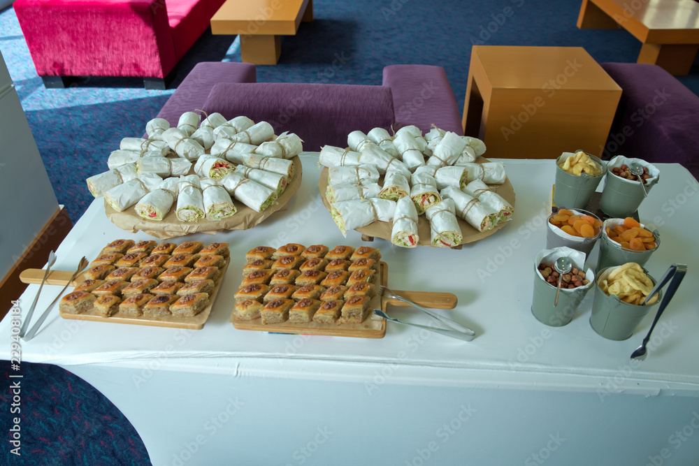 Business and entrepreneurship. The waitress filed a glass of white ...