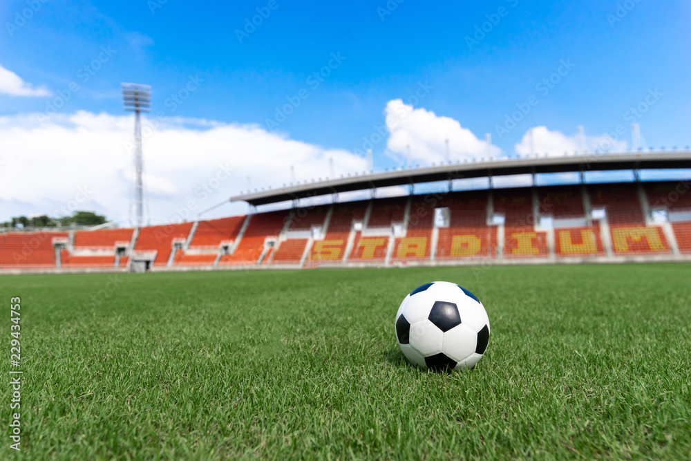 football field ball on green grass , soccer field athletics stadium and ...