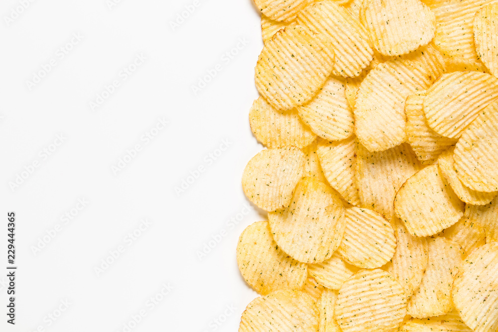 Crispy potatoes chips isolated on white background. Food background ...