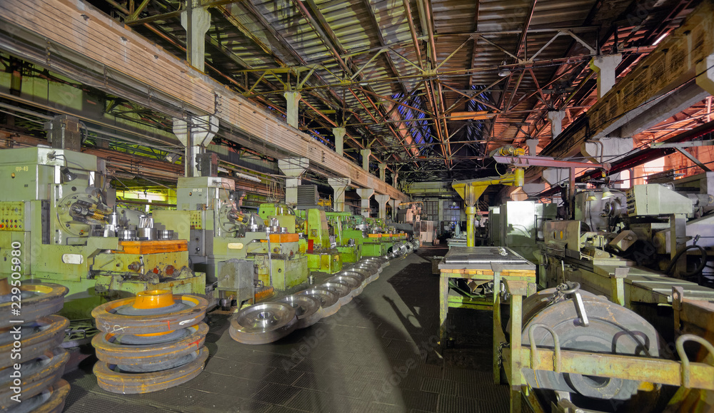 Big machine hall of the metalworking plant indoors room. Many equipment ...