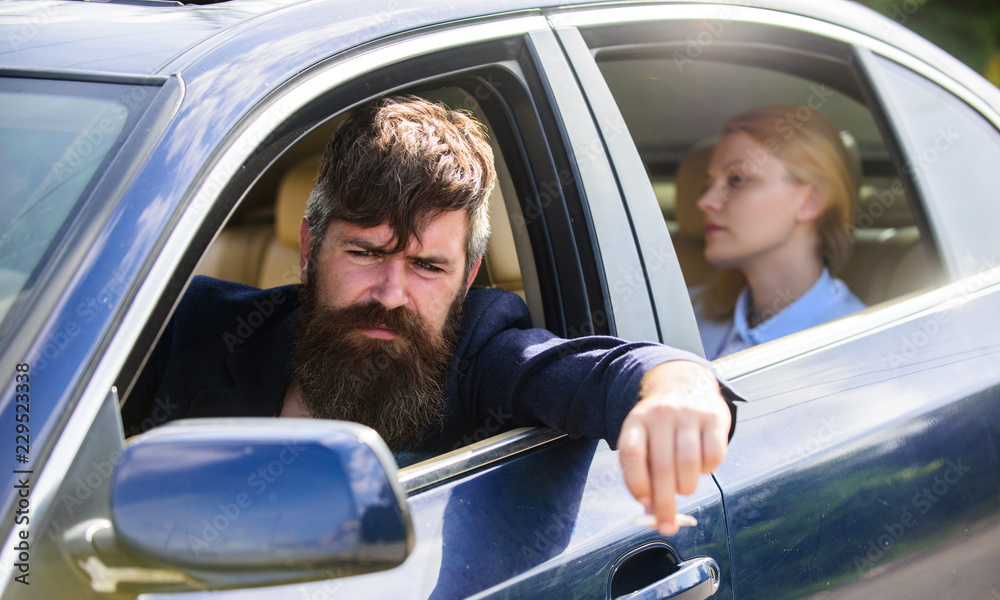 Business woman sit on backseat while bearded driver sit in front. Car ...