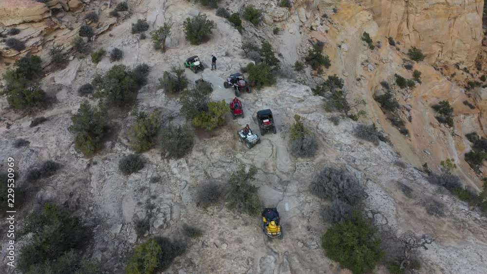 Aerial off road recreation vehicles ATV desert canyon Utah. San Rafael ...