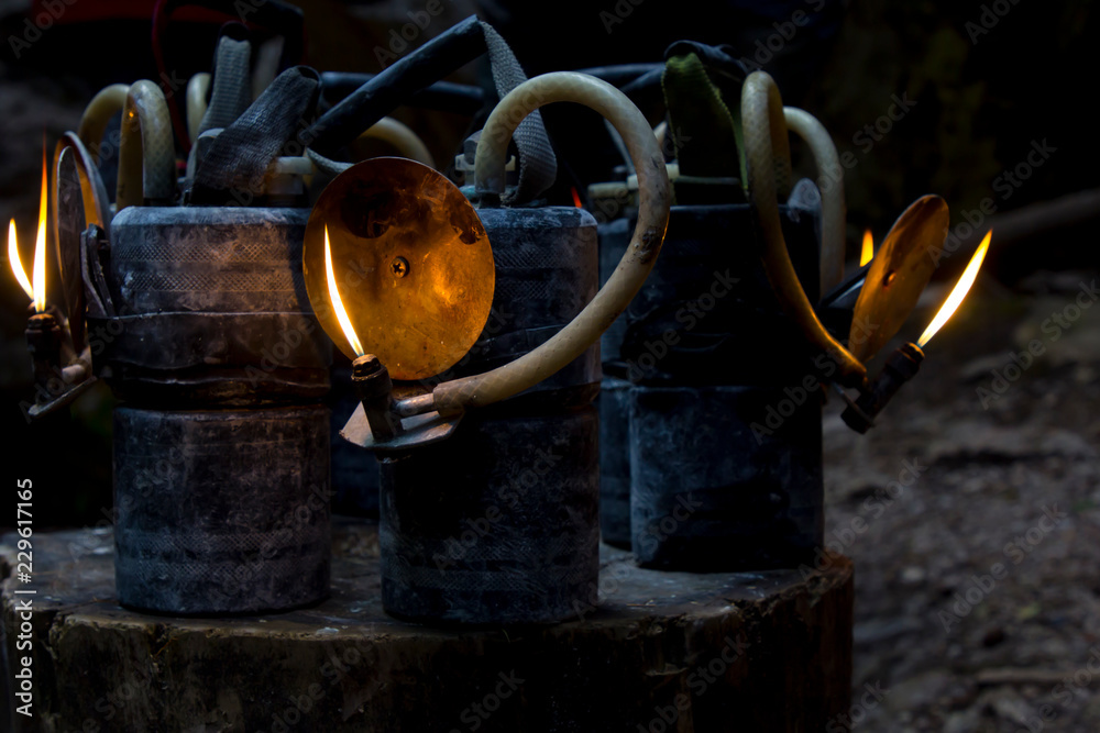 Flame of a gas lamps in a cave Stock Photo | Adobe Stock