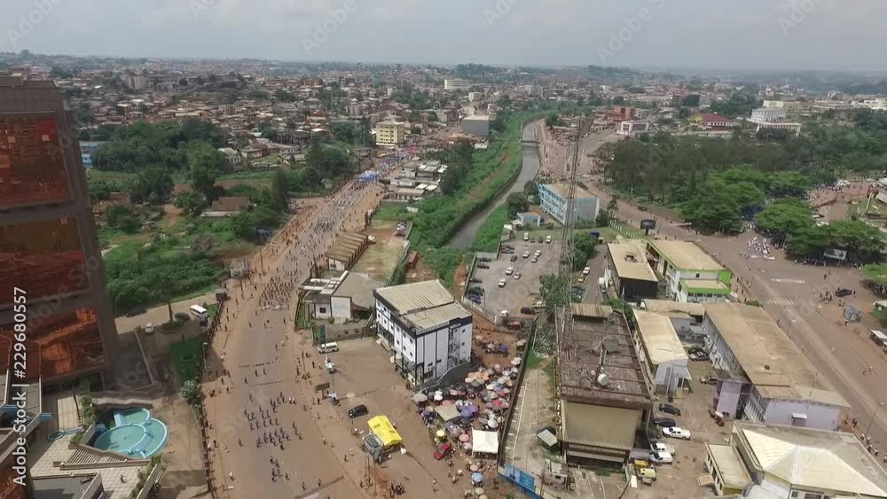 Drone captures the Yaounde parade as it backs up slowly. shortly after ...