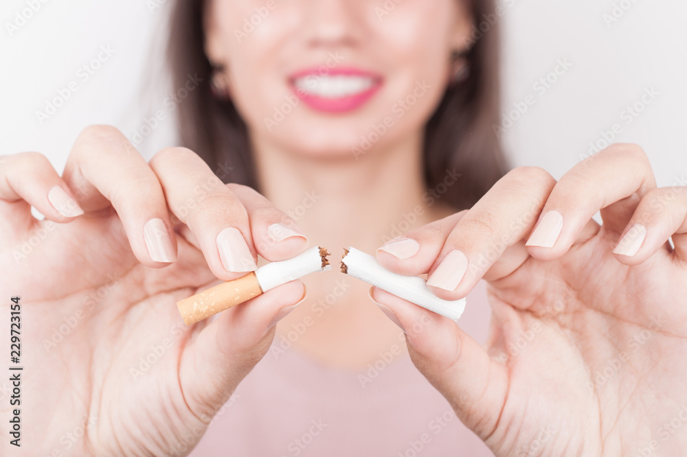 Foto de Stop smoking cigarettes concept. Portrait of beautiful smiling ...