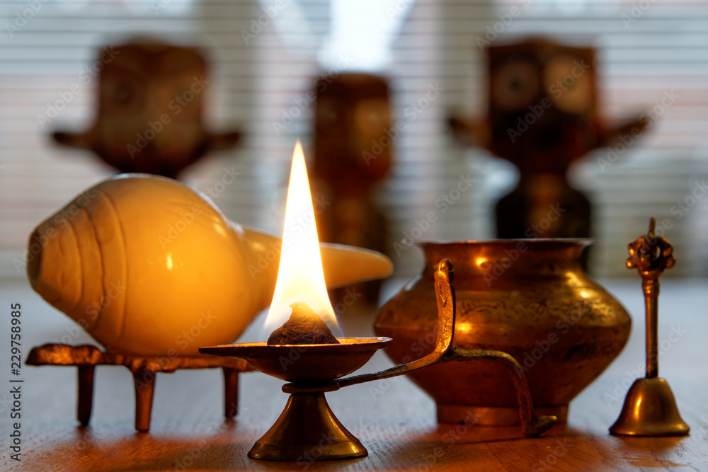 Burning the ghee candle with Puja set and Hindu deity Lord Jagannath in ...