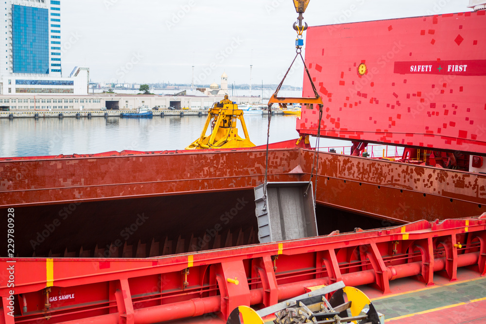 Loading cast iron ingots on ship bulk. Loading metal on ship ...