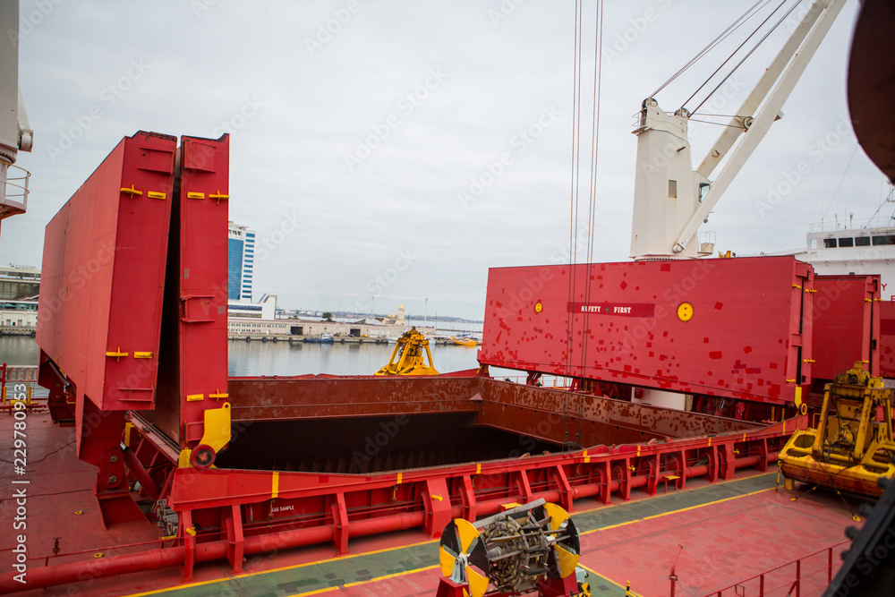 Loading cast iron ingots on ship bulk. Loading metal on ship ...