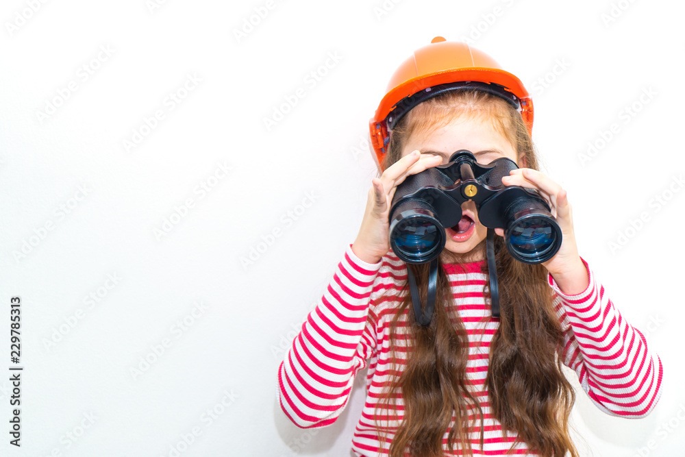 Little girl explorer is looking through binoculars. Stock Photo | Adobe ...