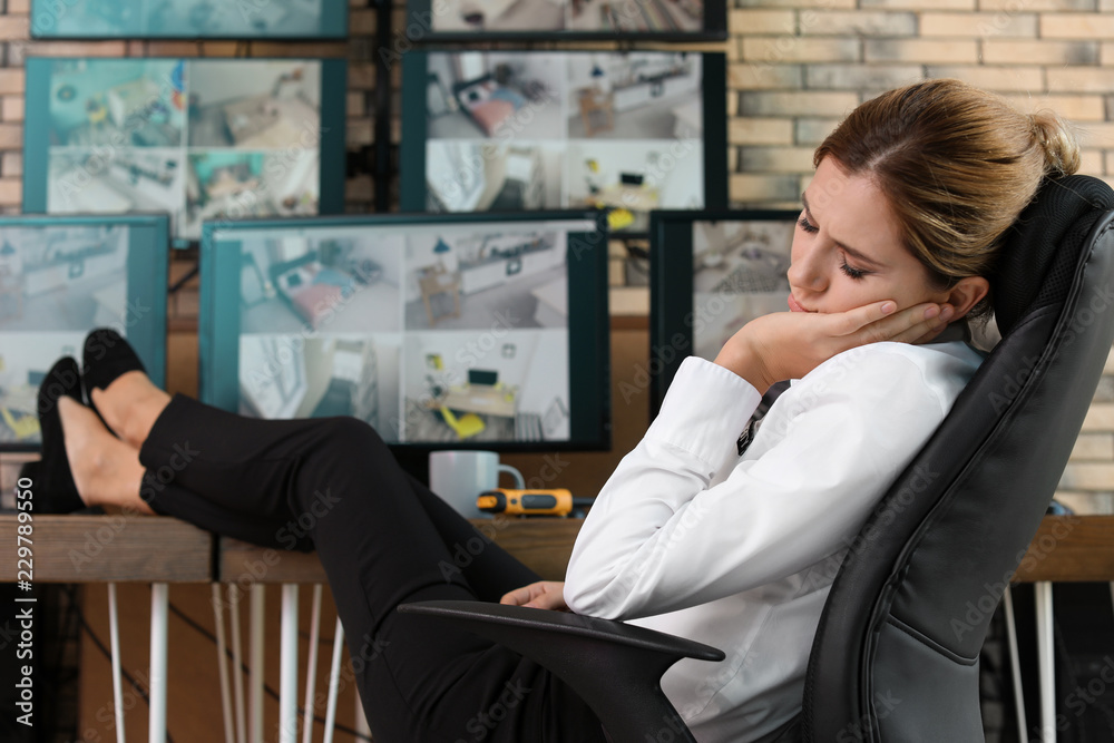 Female security guard sleeping at workplace. CCTV surveillance Stock ...