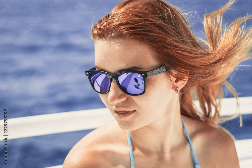 Girl in a blue bikini. Dissolved hair. Journey on the red sea in Egypt ...