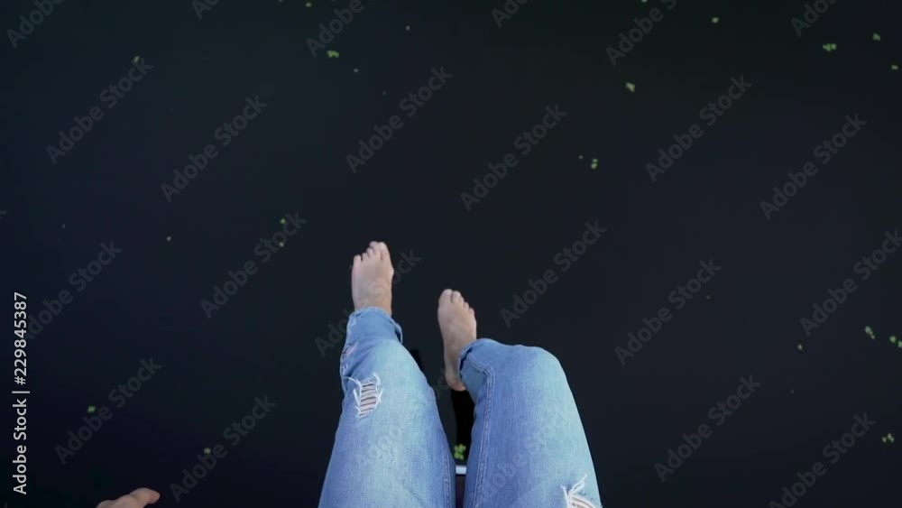 In this slow motion shot you can see woman sitting on the edge of front ...