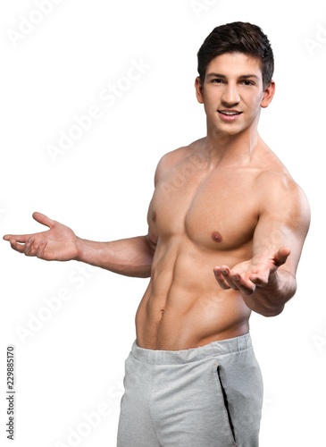 Physically fit shirtless male with his arms out Stock Photo | Adobe Stock