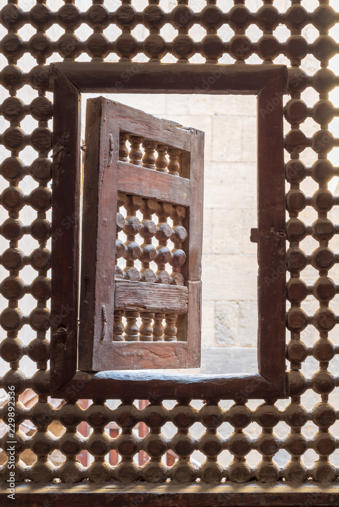 Wooden latticed window (Mashrabiya) with one small swinging sash, Cairo ...