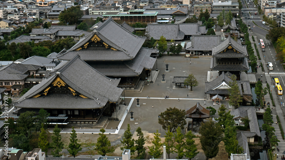 Aerial shots of the city of Kyoto. Skyscrapers and buildings expand out ...