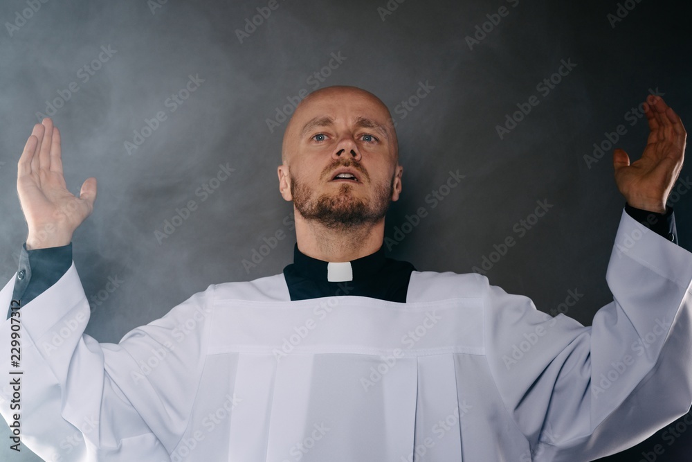 White And Black Catholic Priest