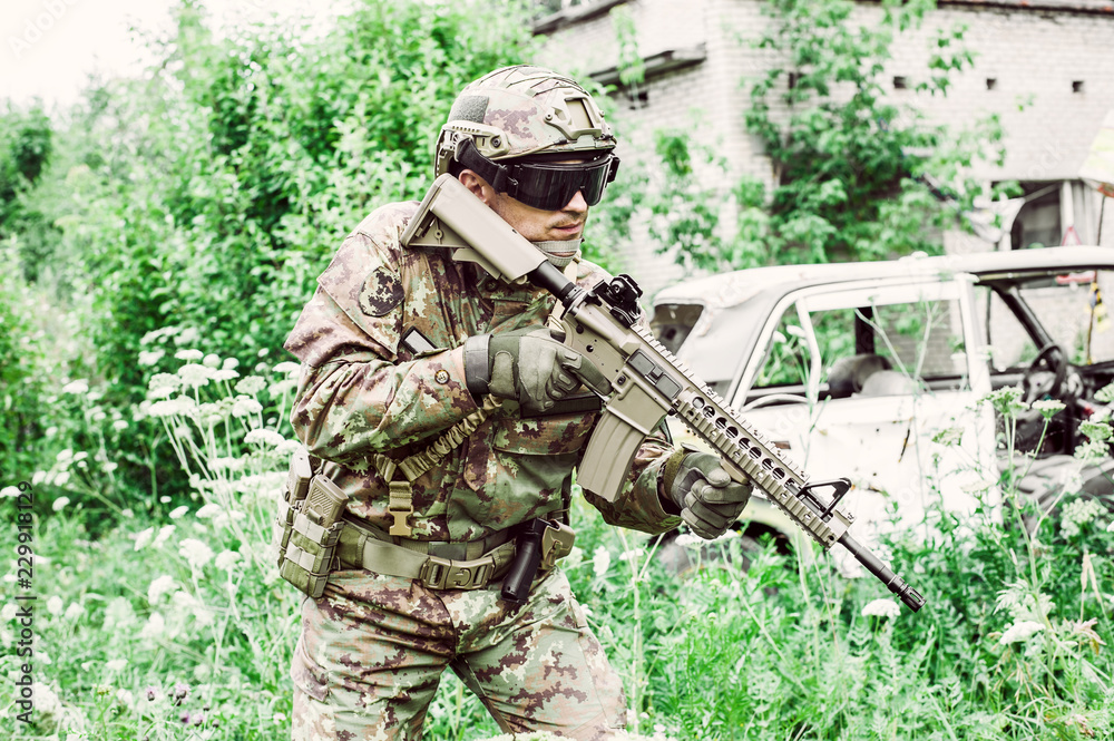 Military man with automatic rifle and rifle scope Stock Photo | Adobe Stock