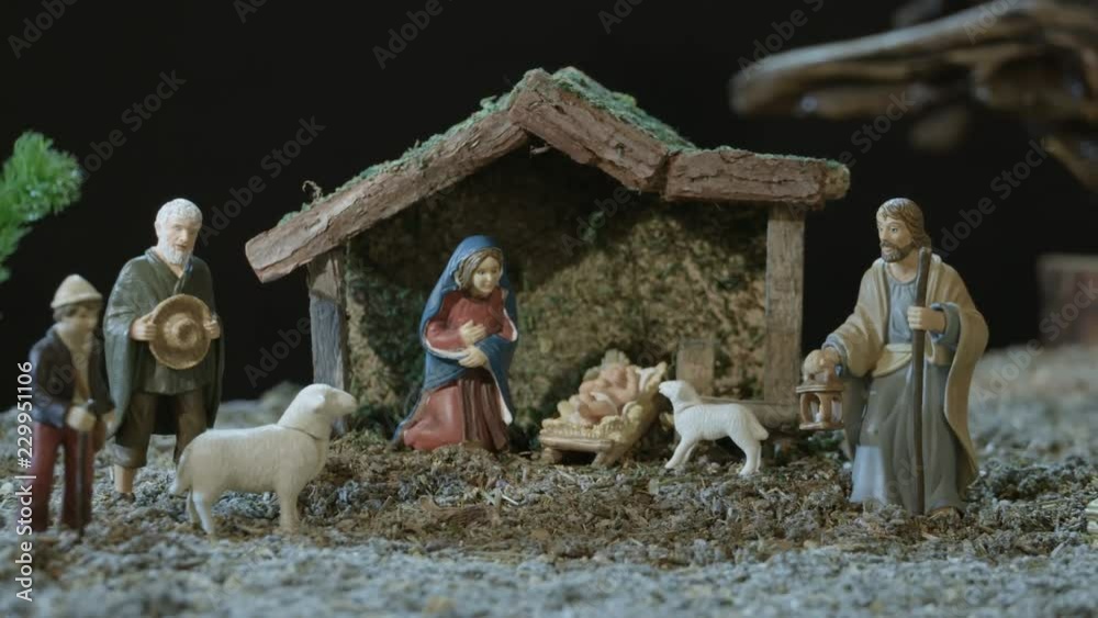 Nativity scene with figurines in the manger including baby Jesus, Mary ...