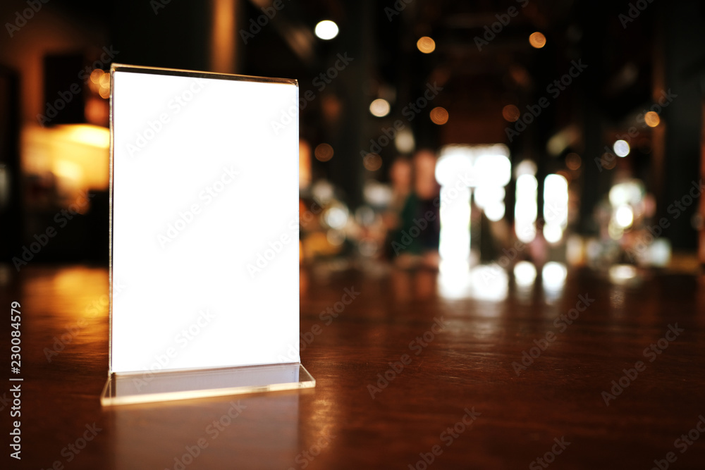 Menu frame standing on wood table in Bar restaurant cafe. space for ...