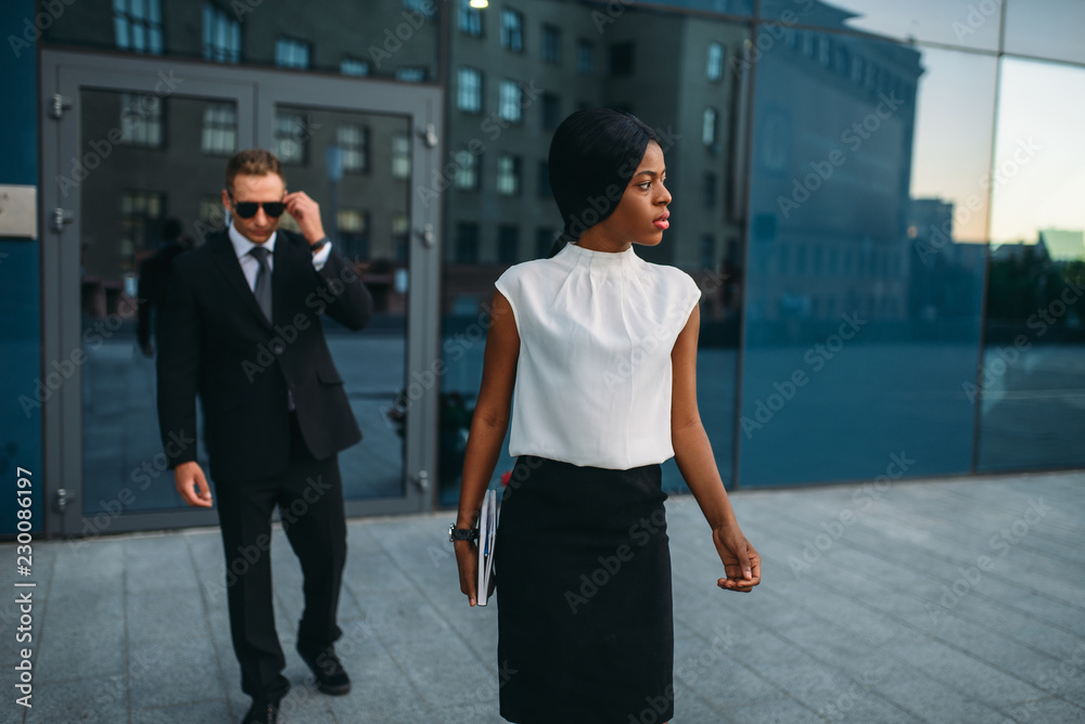 Business woman, bodyguard in suit on background Stock Photo | Adobe Stock