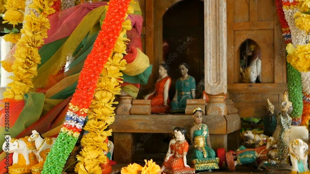 Wooden miniature guardian spirit house. Small buddhist temple shrine ...