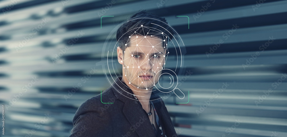 Young guy face ID technology facial recognition use in biometric ...