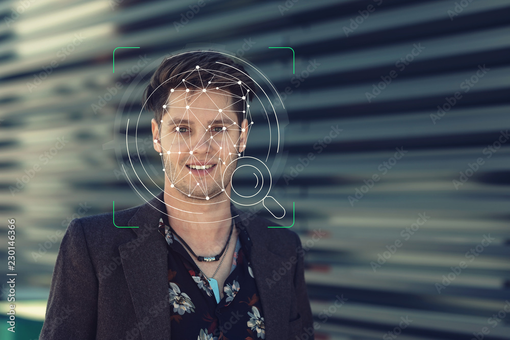 Foto de Young guy face ID technology facial recognition use in ...