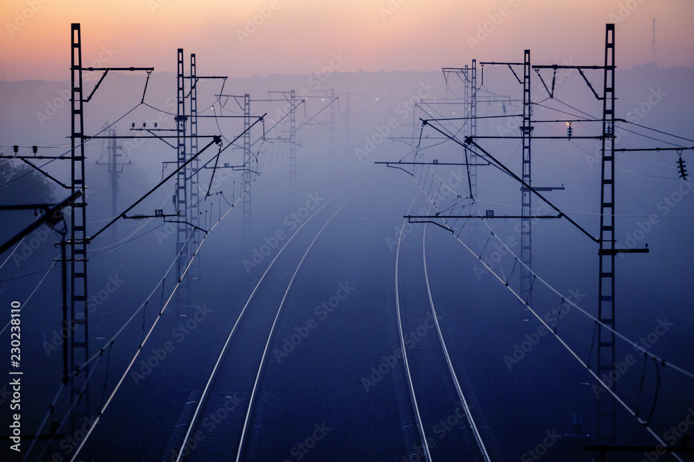 railways & electricity pylons at sunset, industrial landscape Stock ...