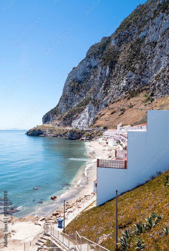 Beach of the Caleta situated in Gibraltar, you see people sunbathing ...
