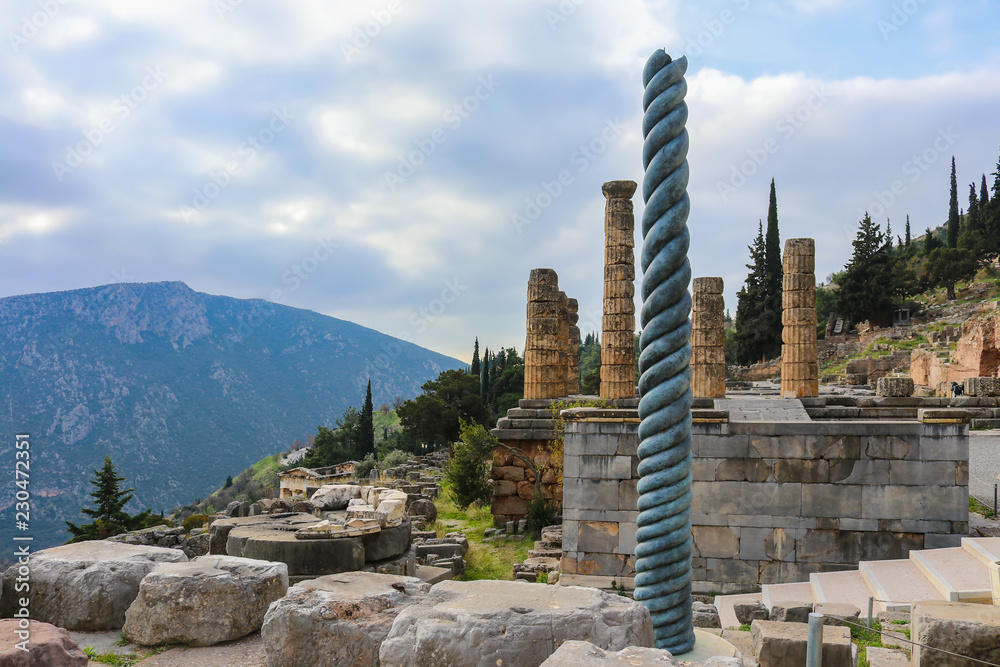 View of mountainside site of ancient Delphi Greece with twisted column ...
