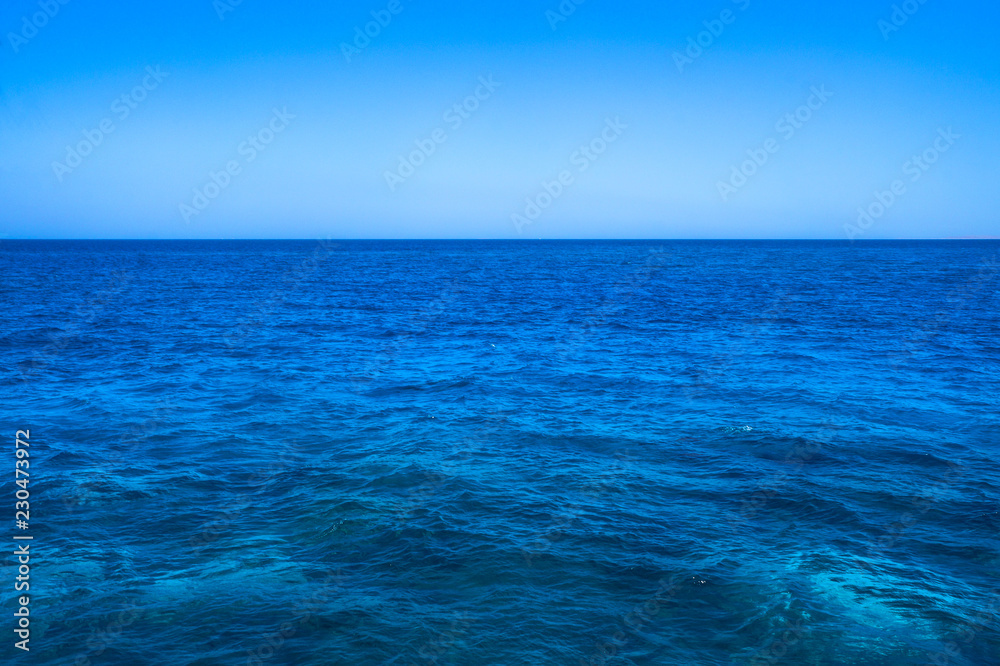 Beautiful blue sea surface with the sky. Oceanic deserted, lonely theme ...