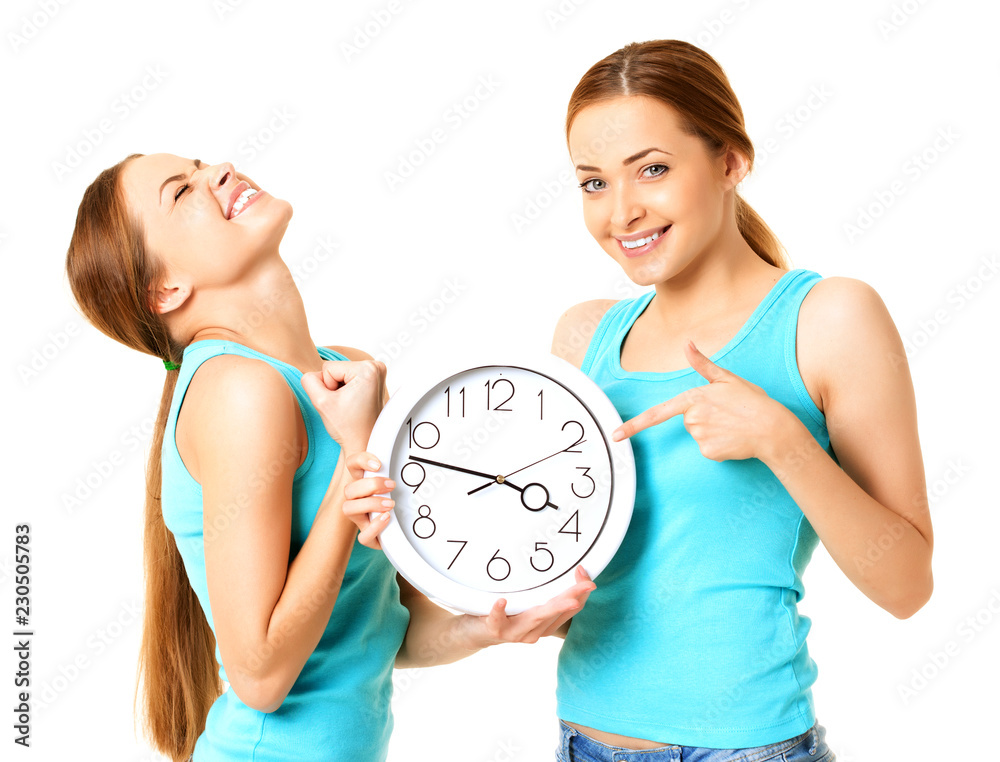 Twins, girls models are surprised. Concept about time, success ...