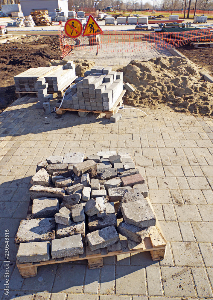 Reconstruction of pedestrian walkway. Laying of new paving blocks Stock ...