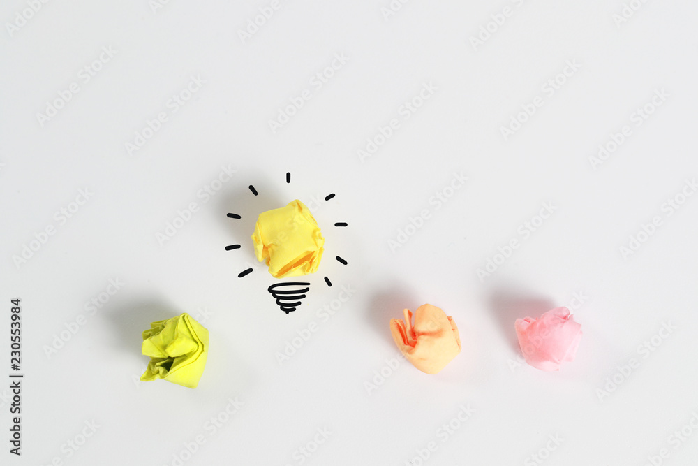 colorful paper color on white background with yellow light bulb (idea ...