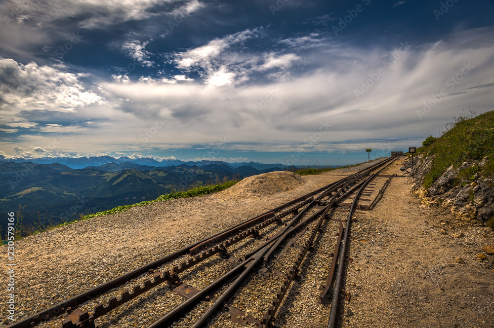 Sliding rail in Schafbergspitze station. Alpine rack railway track to ...