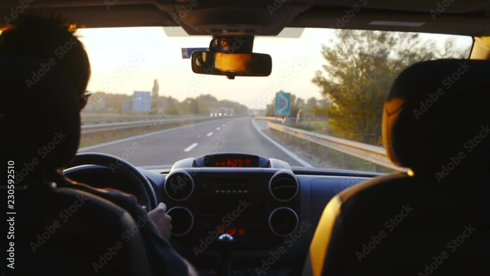 Driving on highway timelapse from backseat view 4K. Static long shot ...