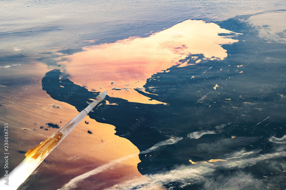 rocket flying over the earth clouds in space, elements of this image ...