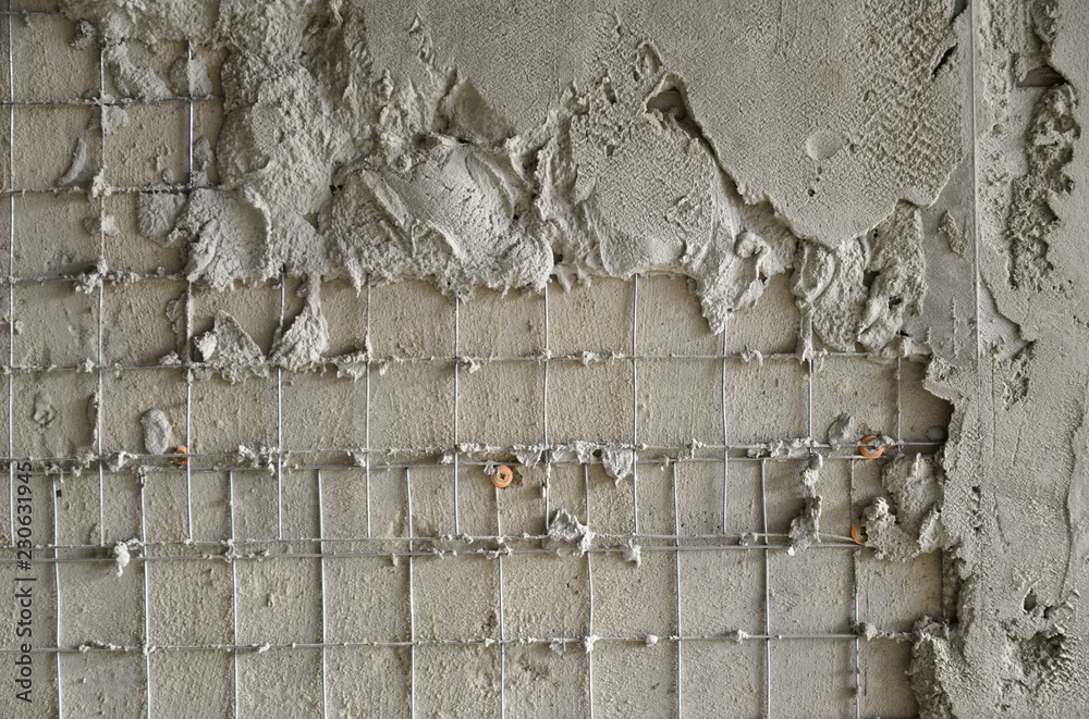 Stages of outer wall cladding with tile when metal armature is attached ...