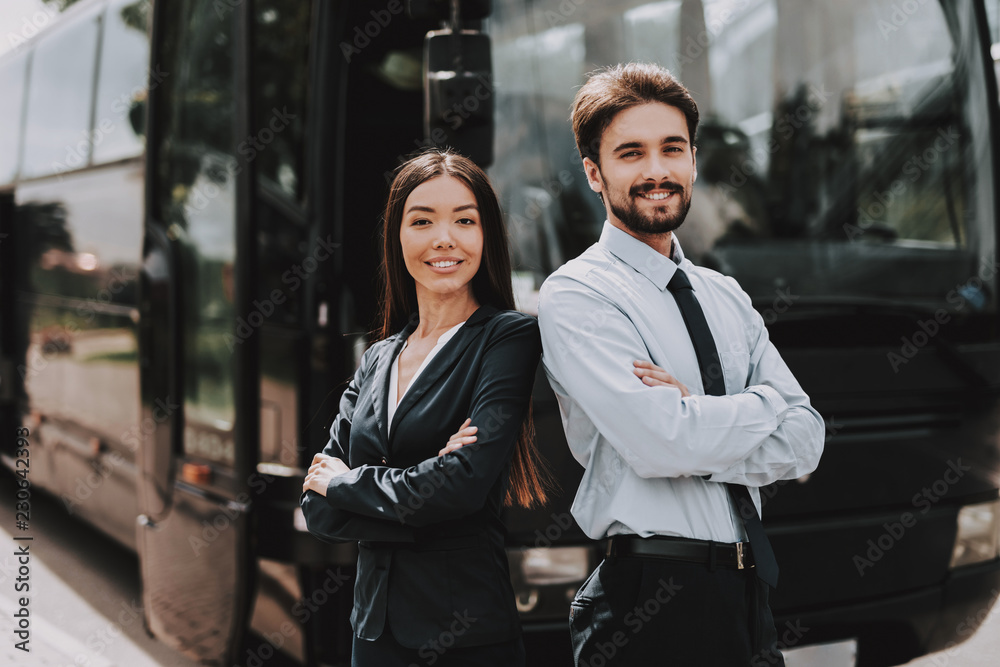 Young Smiling Business People Standing next to Bus Stock Photo | Adobe ...