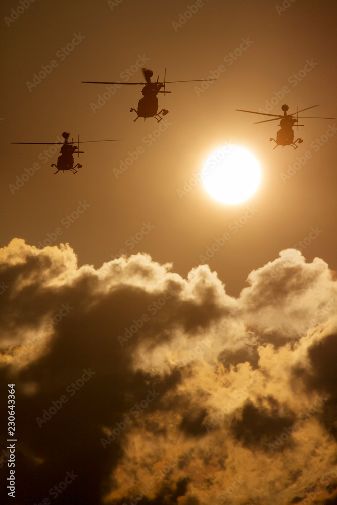 This photo illustration depicts three military helicopters flying ...