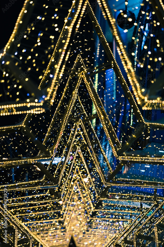 The shining decoration of streets of the night city in the form of a ...