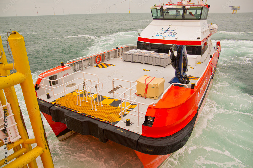 crew transfer vessel docking on service operation vessel, during ...