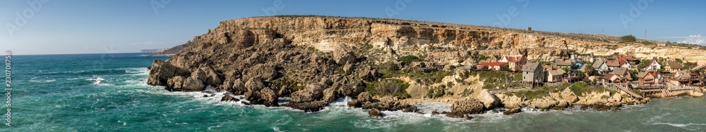 Panorama photo of the famous "Popeye Village" on the rugged rocky ...