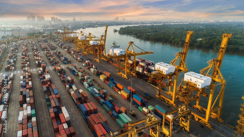 Container ship warehouse and container ship at sea port with working ...